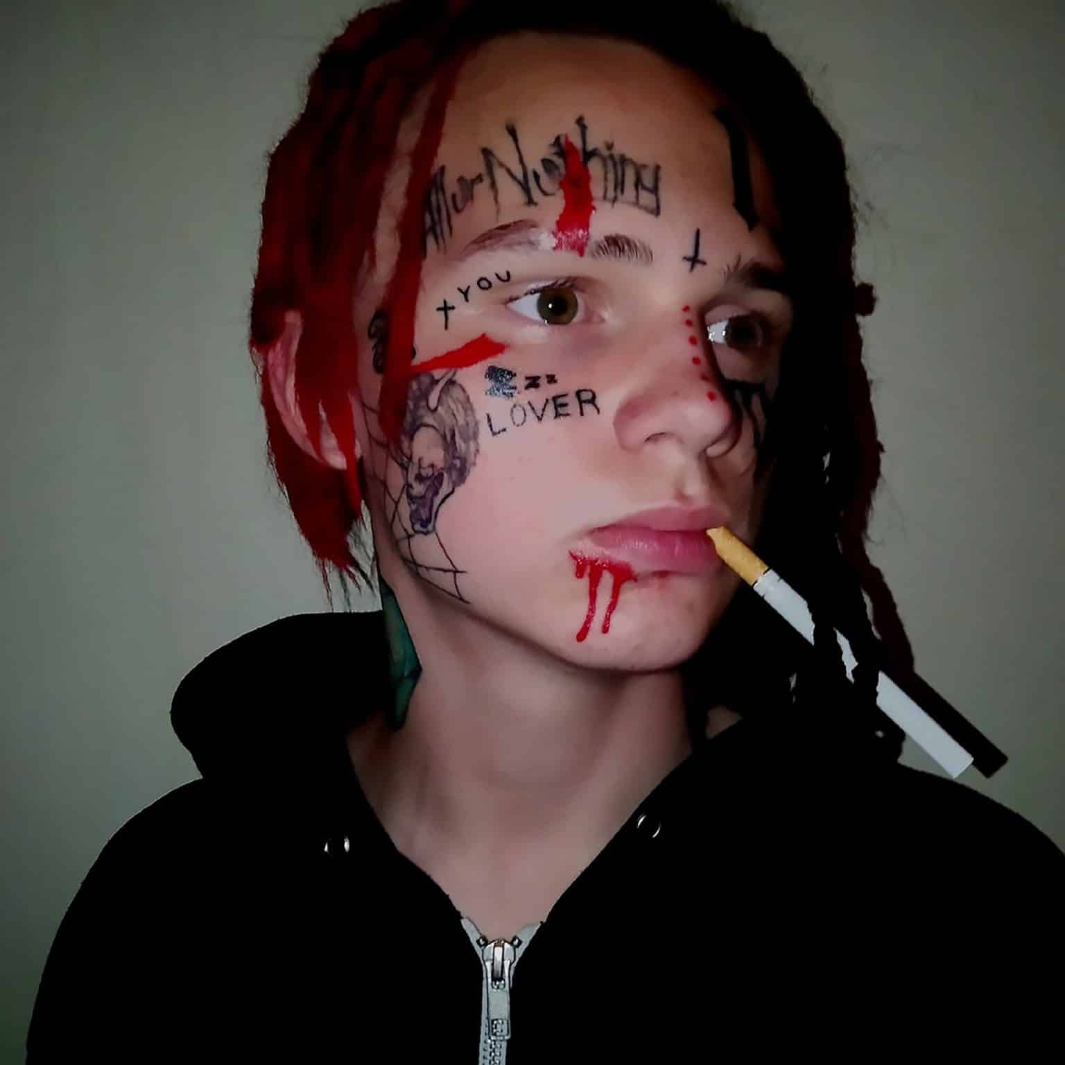 Teen Gets Facial Tattoos To Look Like His Favorite Rapper | Elite Readers